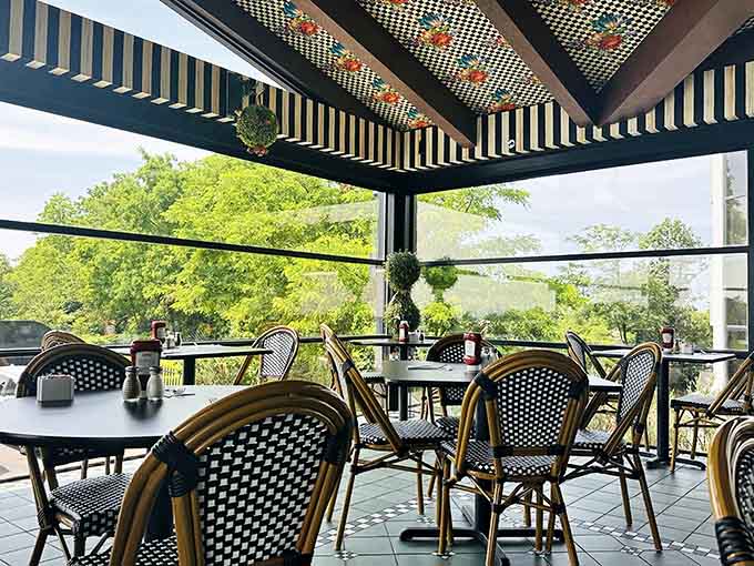 Outdoor seating under a checkered canopy where you can enjoy your meal while pretending you're somewhere fancy.