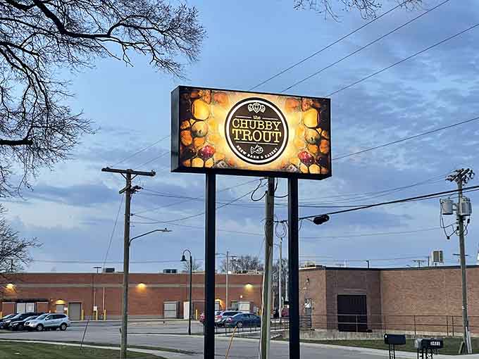 The illuminated sign stands proud against the evening sky, a beacon calling seafood lovers from miles around to come discover something special.