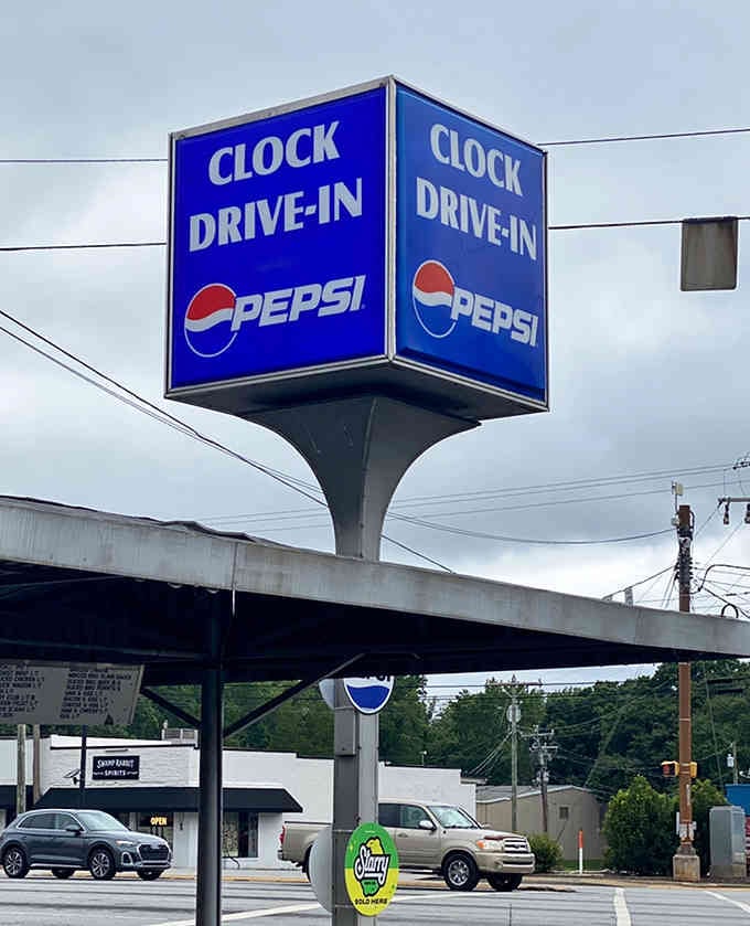 That iconic sign beckons hungry travelers like a lighthouse guides ships safely to delicious harbor.