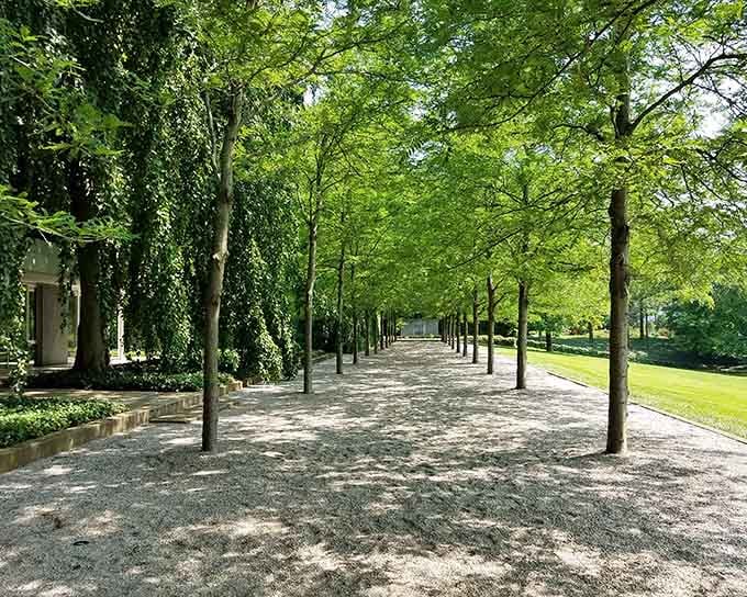 Perfectly manicured paths lead you through gardens that look like they belong in a European estate.