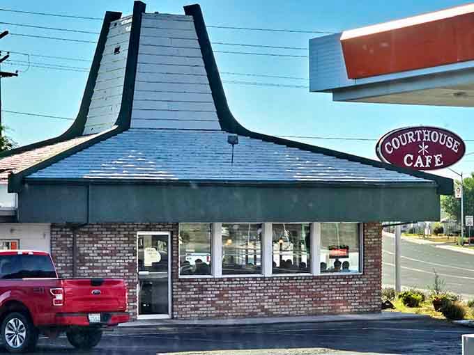The dramatic roofline frames the entrance perfectly, making this corner cafe impossible to miss or forget.