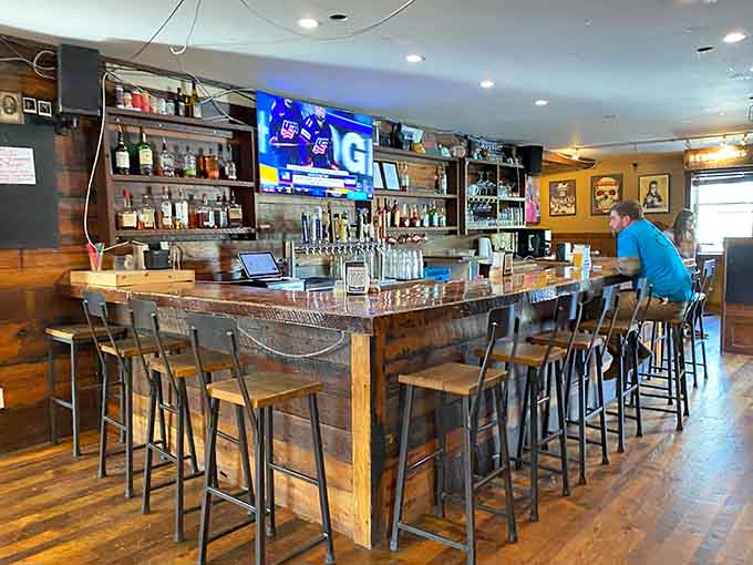 A proper bar with craft beers on tap where you can watch the game and wait for your order.