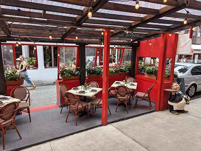 Sidewalk seating under the pergola offers prime people-watching real estate while you twirl your fork through fettuccine.