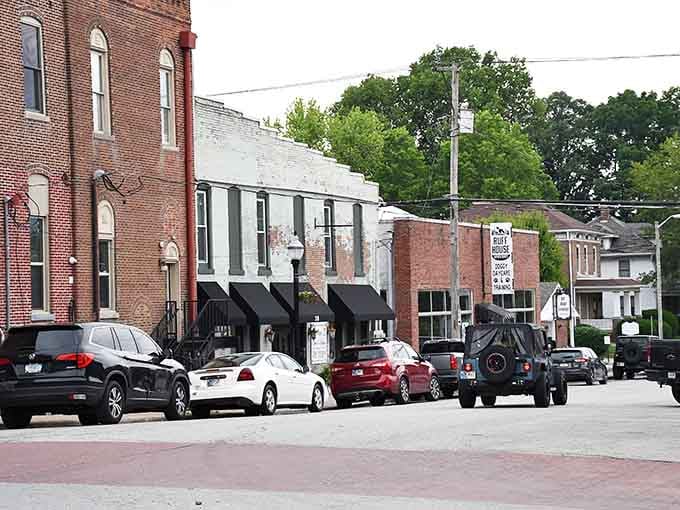 Downtown storefronts line up like old friends, each with its own character, creating the authentic main street experience we're losing.