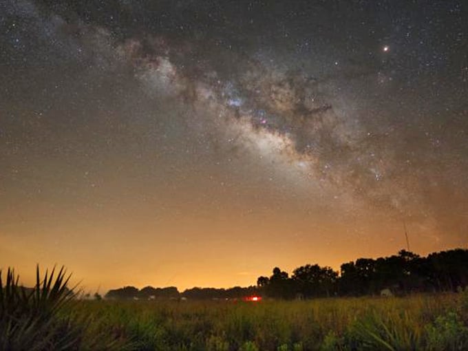The Milky Way stretches across the darkness like cosmic proof that light pollution has been lying to us.