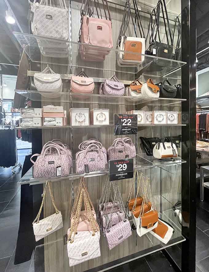 Designer handbags suspended in glass cases like precious artifacts, except these treasures won't require selling your car to own.