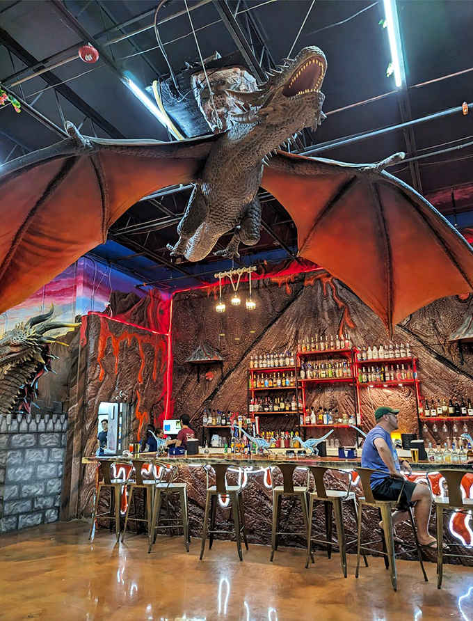 The bar area features a massive winged creature overhead, making your cocktail order feel like a scene from Game of Thrones.