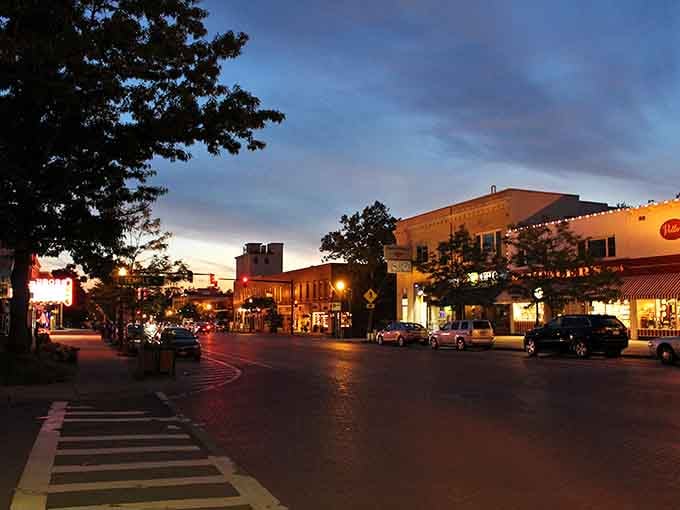 Main Street at dusk when the lights come on and the whole village looks like a Hallmark movie set.