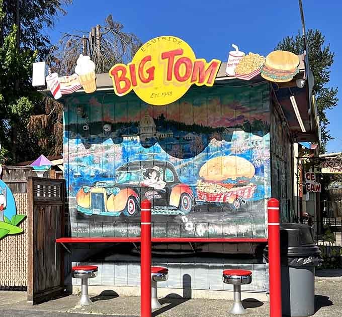 Hand-painted murals showing burgers cruising in classic cars, because nothing says America quite like combining our two greatest loves.