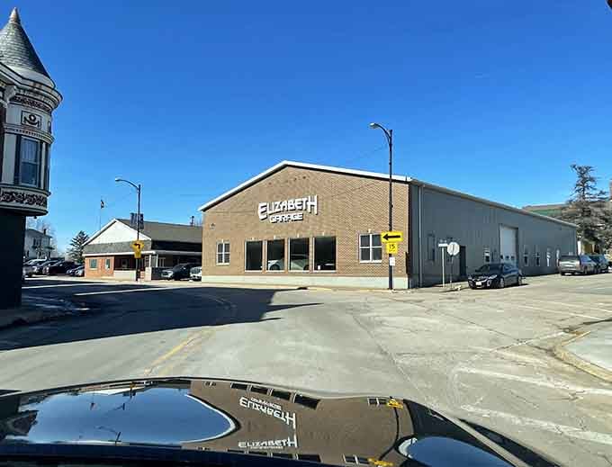 Downtown buildings reflecting in puddles like the town is admiring itself, and honestly, it's earned that right.