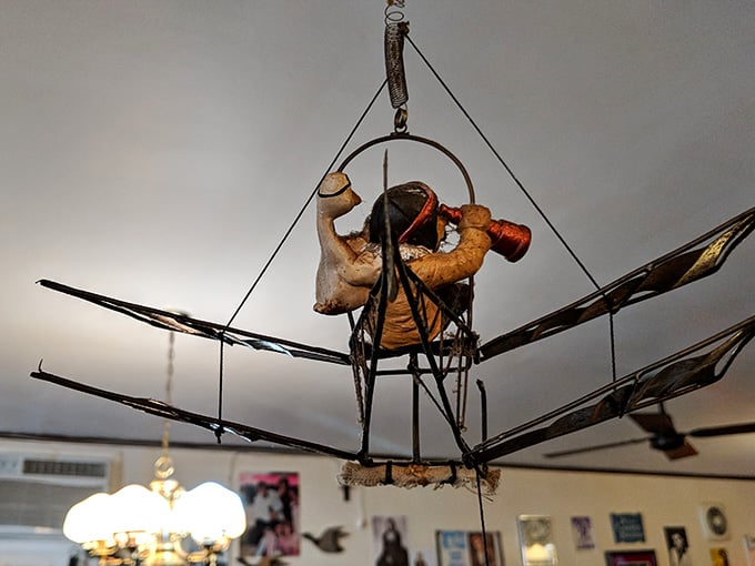 Whimsical hanging decorations add playful touches throughout the dining room, delighting guests who look up occasionally.