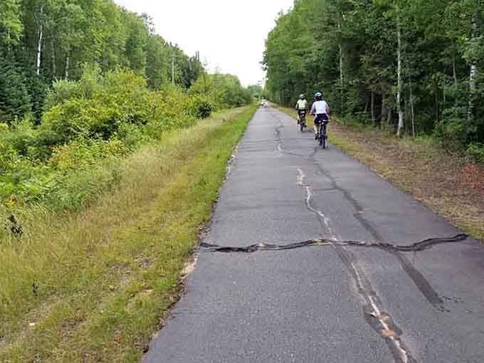 Paved paths stretch through forests, inviting cyclists and walkers to explore at their own peaceful pace.