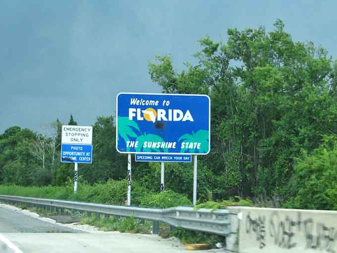Even the "Speeding Can Wreck Your Day" sign can't dampen the excitement of that Florida welcome.