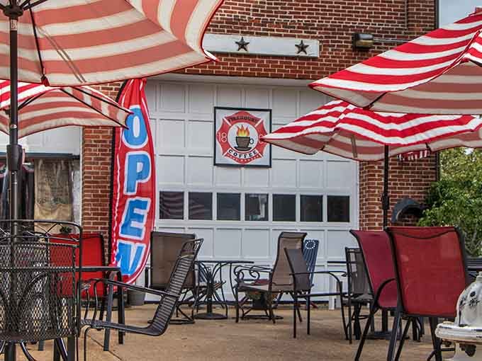 Outdoor seating under striped umbrellas transforms a simple coffee run into a proper al fresco experience worth savoring.