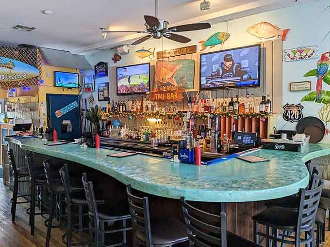 That curved bar beckons like a siren's call, promising cold drinks and warm coastal hospitality always.