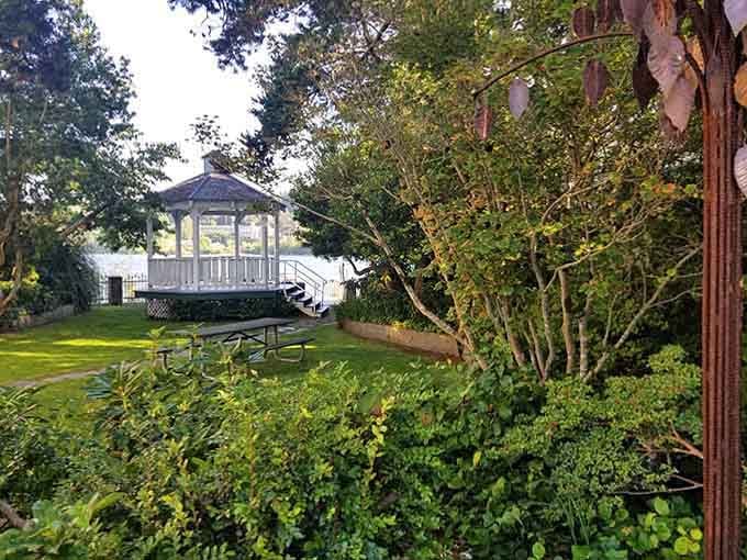 Garden gazebo tucked away like a secret spot where you can read without anyone asking you questions.