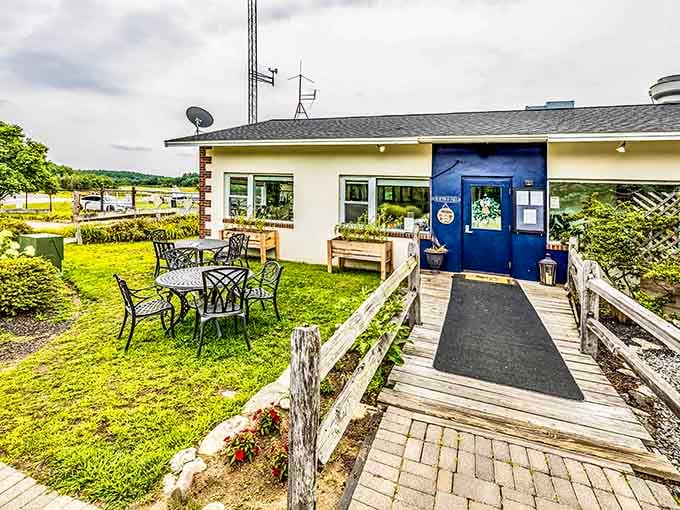 That blue door and outdoor seating area whisper "come on in" louder than any neon sign ever could manage.
