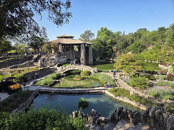 Serene ponds and stone bridges create a Japanese garden oasis that feels worlds away from Texas heat.