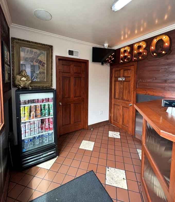 The interior glows with BBQ signage, creating an atmosphere where carnivorous dreams come true every single weekend.