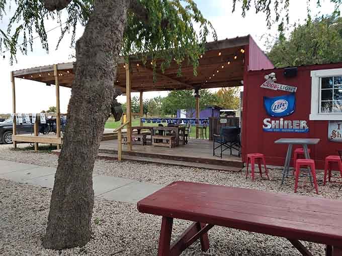 String lights and picnic tables under the covered patio make outdoor dining feel like a backyard party.