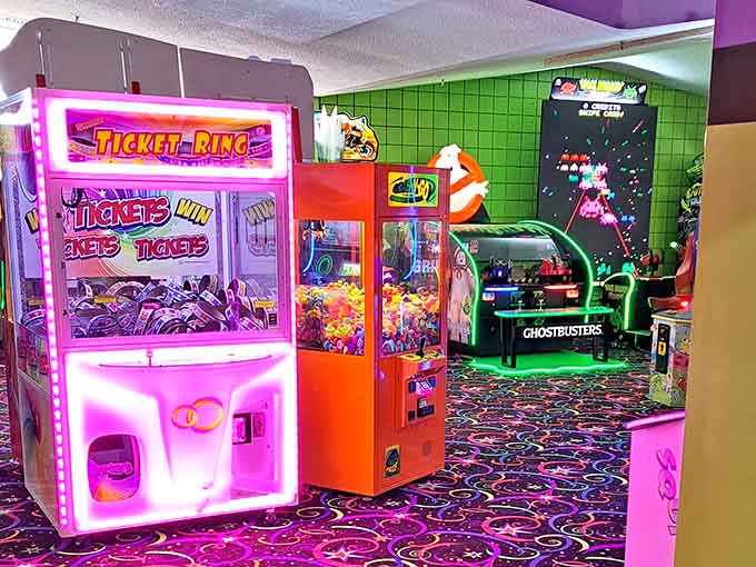 Claw machines and ticket games line up like soldiers, ready to separate you from tokens cheerfully.
