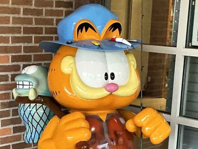 Fisherman Garfield displays his catch, finally finding a hobby that combines sitting still with potential food rewards.