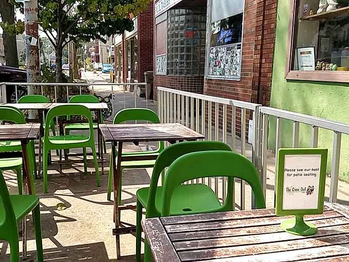 The outdoor patio with green chairs offers prime people-watching real estate on Atwood Avenue during Madison's glorious warm months.