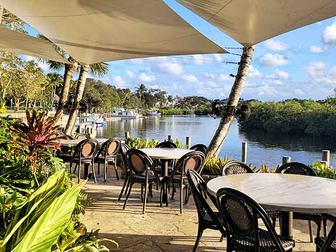 Waterfront tables overlooking the Loxahatchee River where time slows down and worries float away with boats.