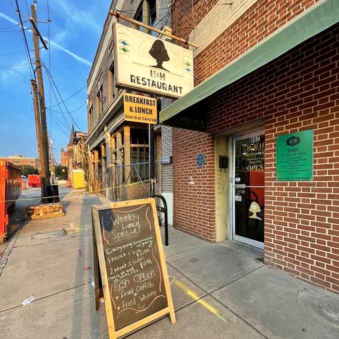 The exterior signage welcomes you to a place where eating a biscuit for peace isn't just cute; it's policy.