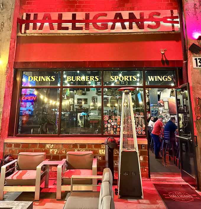 The glowing red entrance beckons like a beacon, promising good times and great food just beyond those welcoming doors.