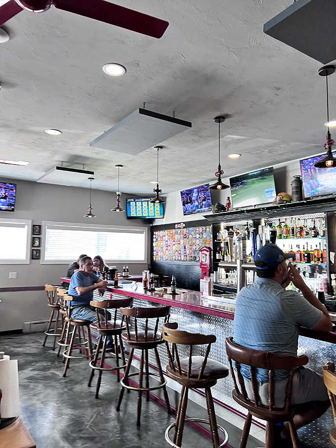 Multiple screens keep you connected to the game while that polished bar beckons you closer for refreshment.