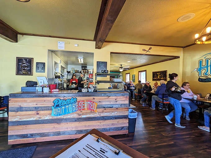 Happy diners enjoying their oversized breakfast creations in a space that feels welcoming, unpretentious, and wonderfully comfortable.