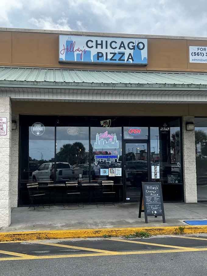 The welcoming entrance to your new favorite pizza destination, complete with outdoor seating for Florida weather.
