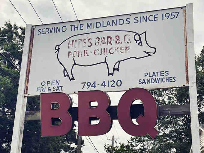 A weathered sign that's earned every bit of its character through decades of delivering on promises.