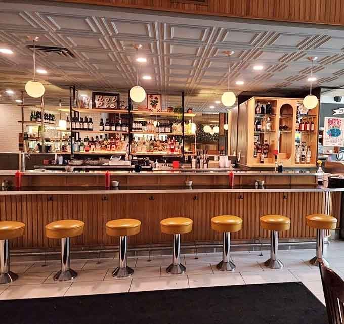 Chrome-legged stools line up like soldiers at attention, ready to support your pie-eating mission with retro flair.