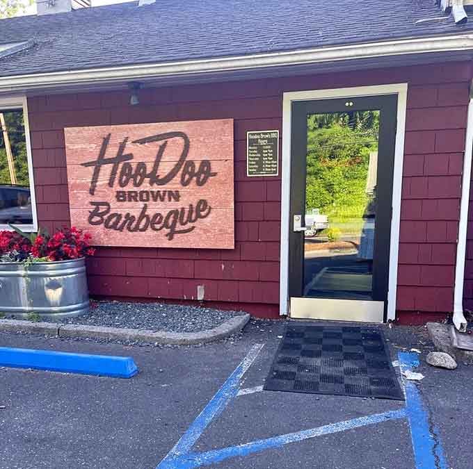 The entrance welcomes you with that wooden sign, promising authentic barbecue adventures await inside those doors.