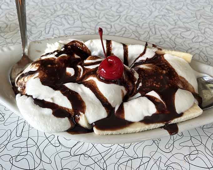 Dessert drizzled with chocolate and topped with a cherry, because you've earned it after that meal.