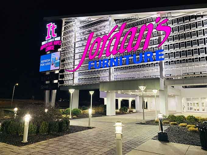 By night, Jordan's Furniture transforms into a beacon for anyone seeking adventure that doesn't involve assembling flat-pack furniture.