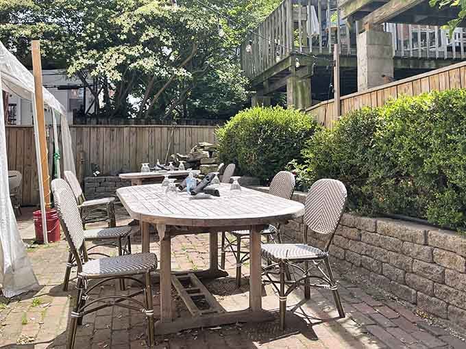 The outdoor patio offers a peaceful escape where you can enjoy your meal surrounded by greenery and good vibes.