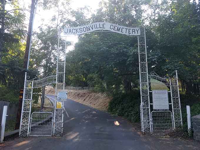 Jacksonville Cemetery's ornate entrance guards stories of pioneers, dreamers, and characters who built this remarkable town from absolutely nothing.