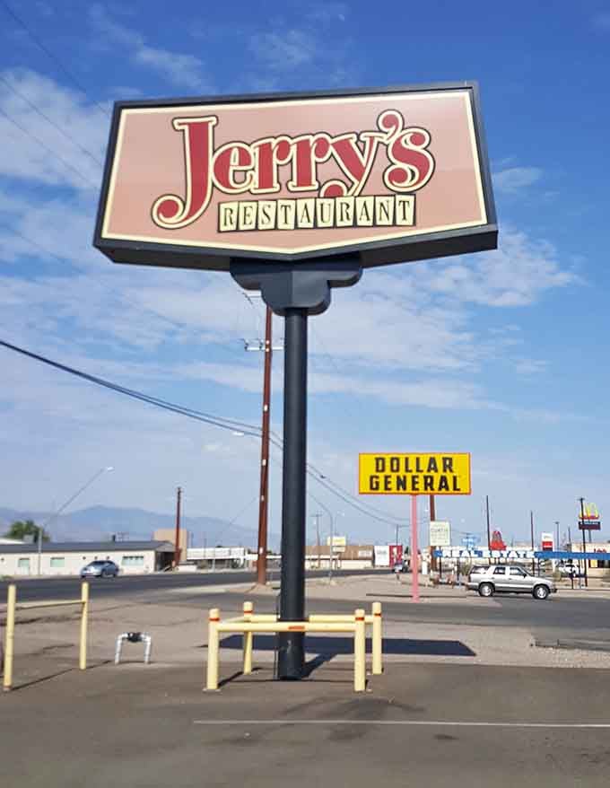 That retro sign stands tall like a beacon guiding hungry travelers to their breakfast salvation below.