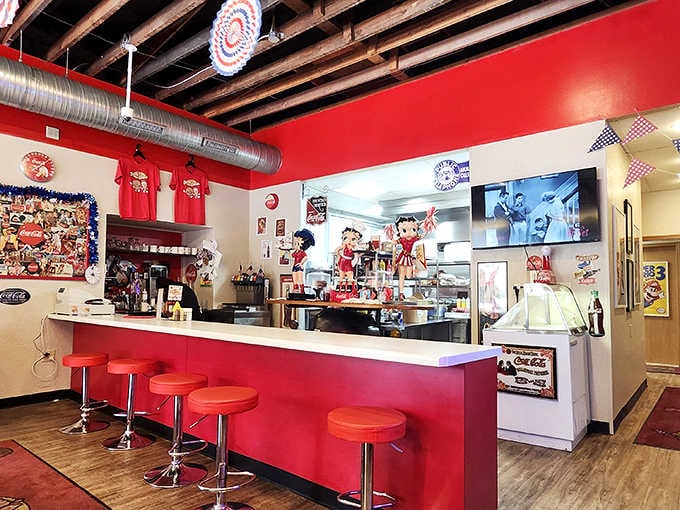 Counter seating with red stools where you can watch the magic happen while contemplating your next order.