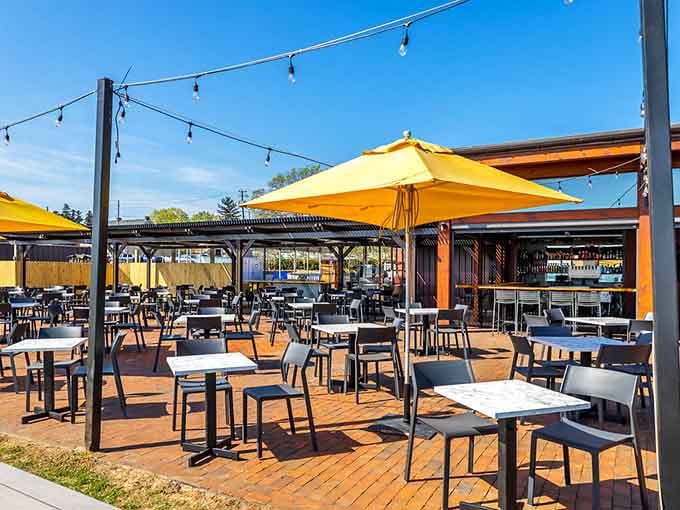 Yellow umbrellas dot the expansive patio like sunshine, creating the perfect spot for warm-weather dining adventures.