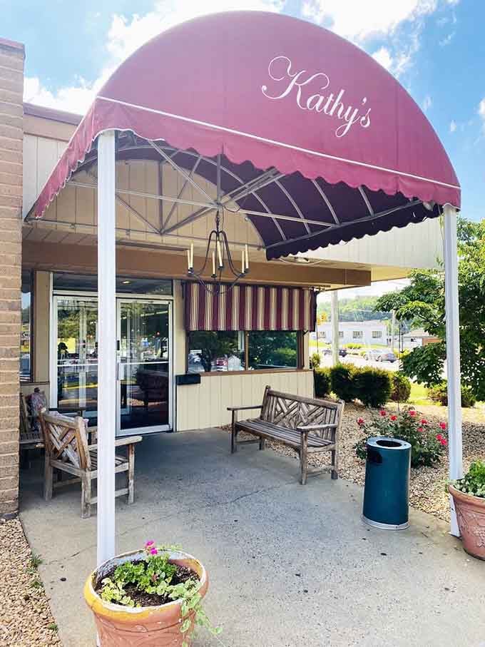 A welcoming bench under that signature awning invites you to pause, rest, and contemplate the pancake possibilities awaiting inside.