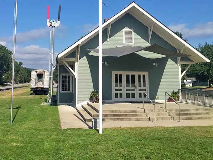 The restored Landrum Depot stands as a mint-green reminder of when trains brought travelers instead of just romantic notions.