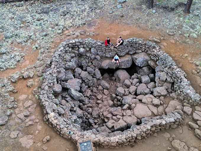 From above, the entrance looks deceptively small, barely hinting at the mile-long tunnel stretching beneath your feet.