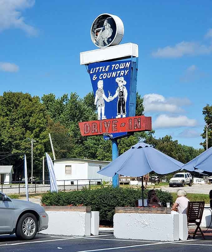 That vintage drive-in sign is a beacon for anyone seeking authentic American diner food and nostalgia.