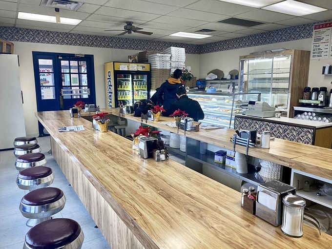 Behind the counter at Luke's Donut Shop Inc, where the magic happens and fresh batches emerge to save your morning.