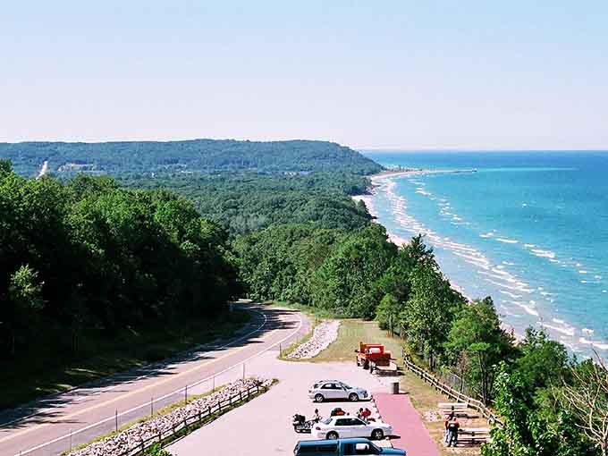 The perfect M-22 moment captured from above, where forest meets water and you remember why Michigan is pure magic.