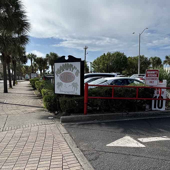 The roadside sign welcomes customers with palm trees flanking it, perfectly capturing that Myrtle Beach breakfast destination energy.